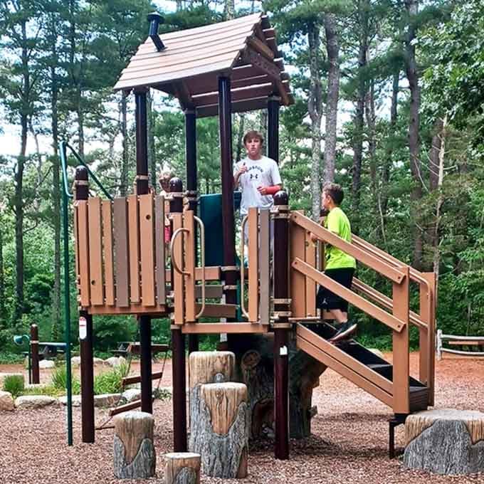 Kids climbing, parents relaxing&mdash;the playground area nestled among pines offers a welcome break from screens and a return to good old-fashioned fun.