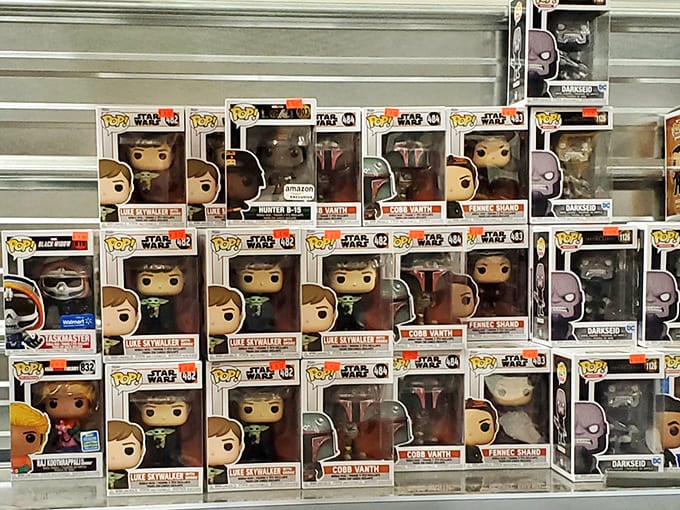 Pop figure nirvana! Star Wars characters stand at attention, silently judging your collecting habits while simultaneously begging to join your display shelf.