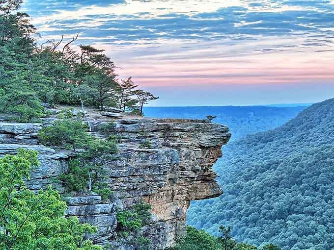 Sunrise paints the cliff face in golden hues, transforming ordinary rock into something magical. Worth setting that early alarm for.