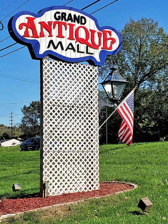 The siren call for treasure hunters! This vintage sign stands as a beacon to those who know that yesterday's castoffs are today's must-haves.