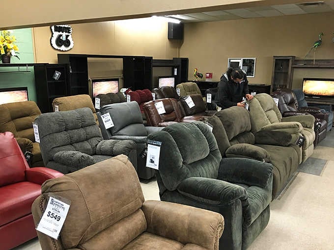 Recliners as far as the eye can see. That green velvet number is practically begging to become your new Sunday afternoon nap headquarters.
