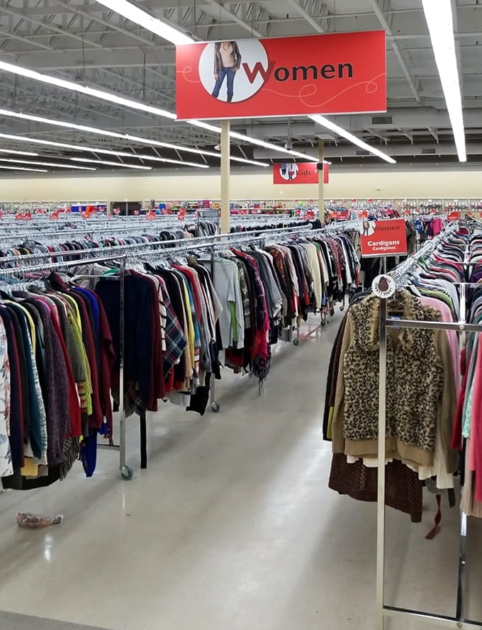 Under the watchful eye of the "Women" sign, a rainbow of fashion history unfolds. Yesterday's trends become tomorrow's vintage finds.