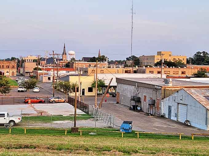 Greenville's skyline at golden hour shows the mix of historic church steeples and buildings that give this Delta town its unique character.