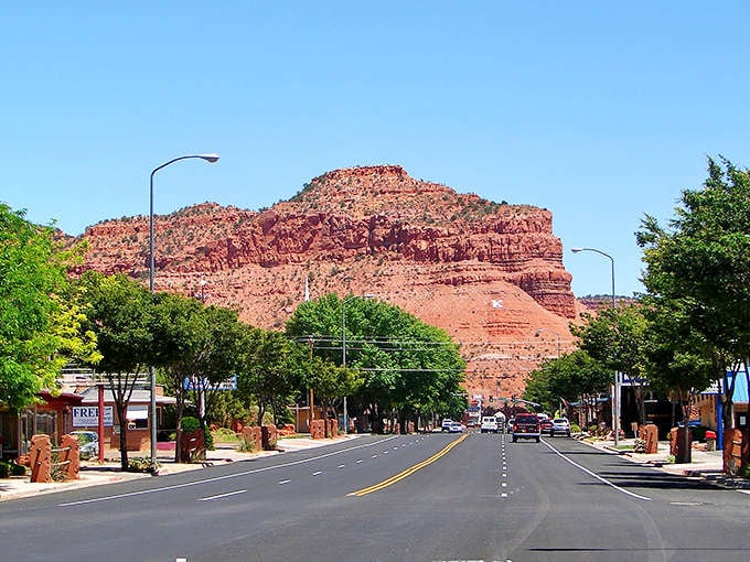 Kanab's Main Street stretches toward red rock formations that have starred in more Westerns than John Wayne himself.