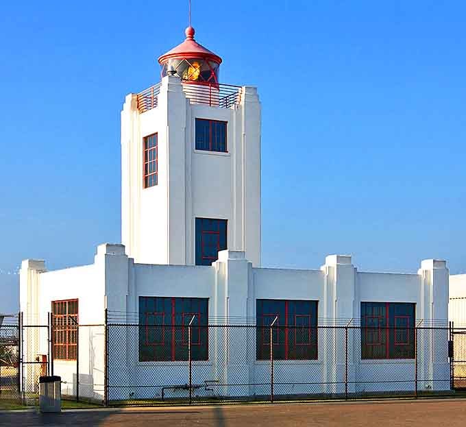 Port Hueneme's historic lighthouse stands guard over the harbor, a postcard-perfect scene from California's working coast.