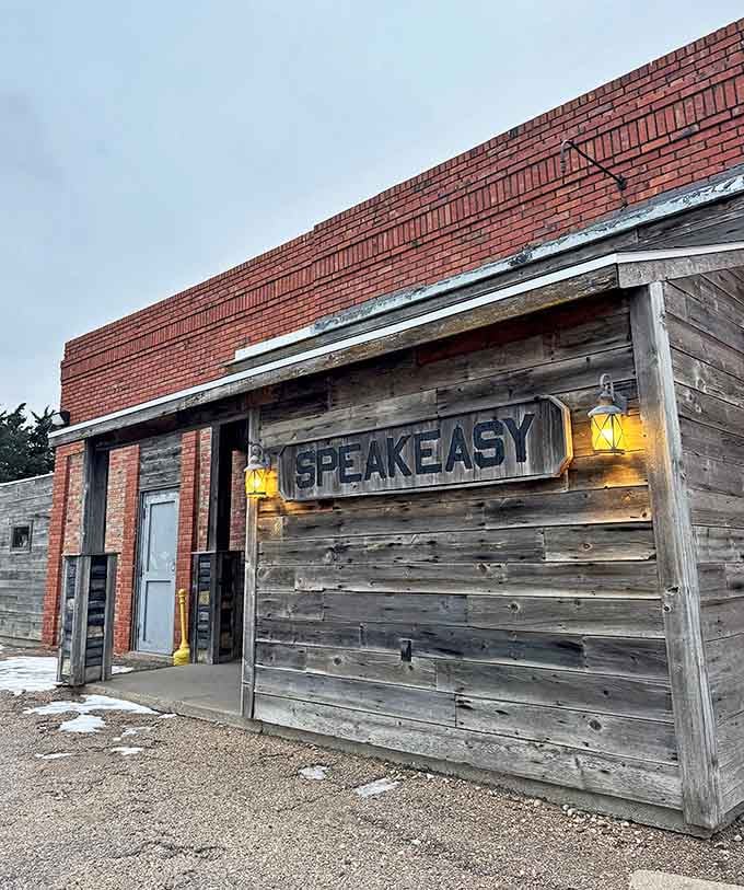 Weathered barn wood and glowing lanterns create an atmosphere that whispers secrets from Prohibition-era Nebraska nights.
