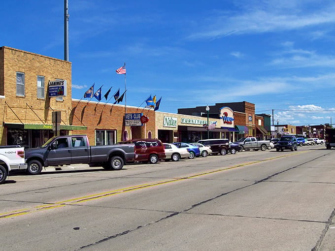 Valentine's main street showcases classic storefronts with American flags proudly displayed, embodying small-town Nebraska charm that feels straight out of Smallville.