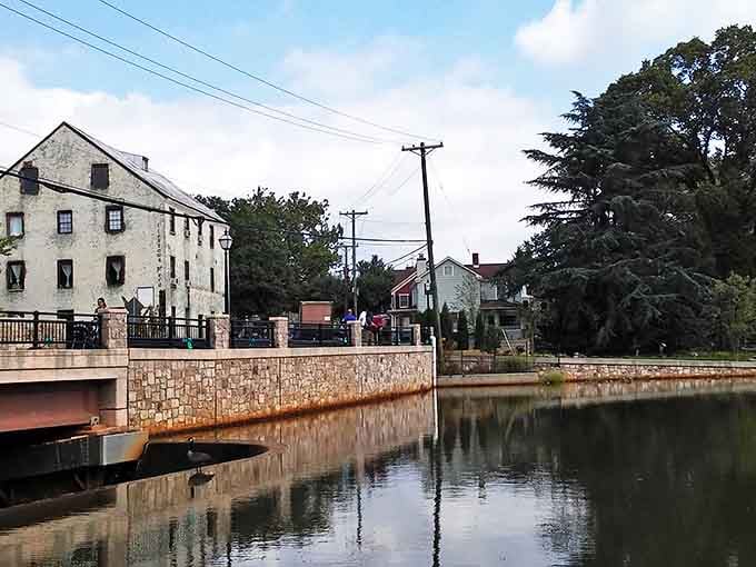The peaceful bridge over Allentown's mill pond creates perfect reflections, inviting you to pause and appreciate this tranquil small-town scene.