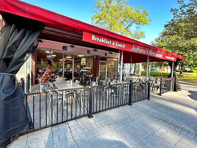 Johana's outdoor seating area invites you to enjoy your breakfast al fresco. Red awnings and fresh air make those pancakes taste even better.