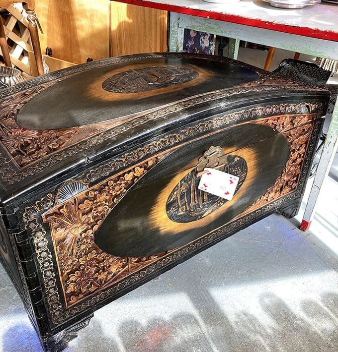 Carved with the patience only our ancestors seemed to possess, this wooden chest could hold your treasures or secrets with equal elegance.