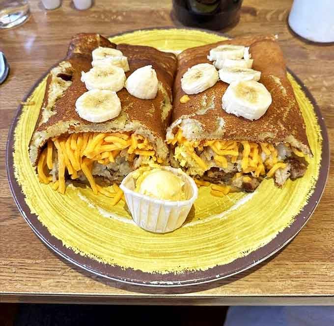 Breakfast innovation at its finest—pancakes transformed into wraps filled with savory goodness and topped with banana slices.