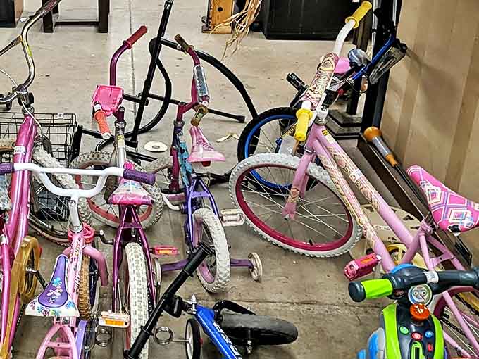 A bicycle ballet frozen in time. These pink beauties are ready to create childhood memories all over again, training wheels and all.