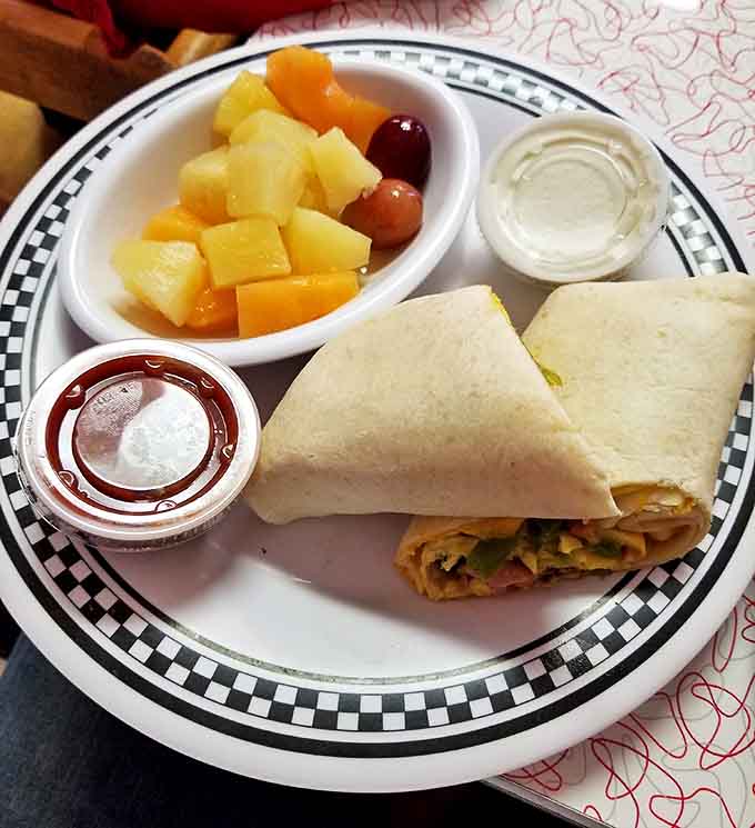 Breakfast goes portable with this wrap that's accompanied by fresh fruit &ndash; the diner's version of "I'm being healthy" while still thoroughly enjoying yourself.