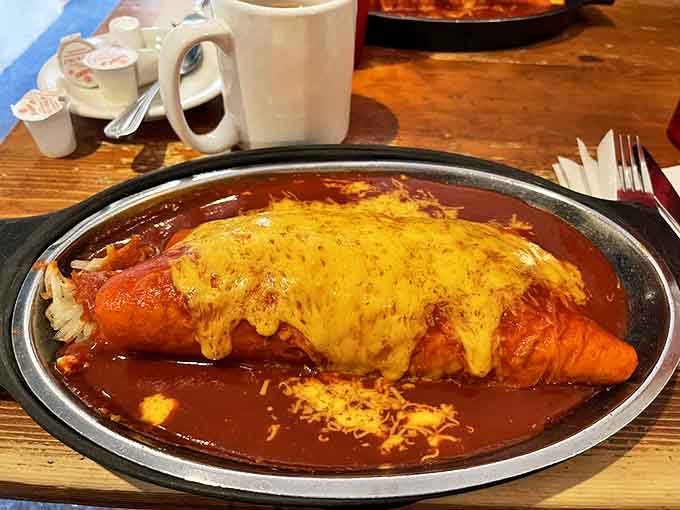 This breakfast burrito isn't just smothered in red chile&mdash;it's embraced by it. Melted cheese creates the comfort blanket you didn't know you needed.