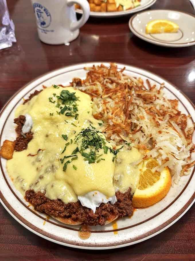 Eggs Benedict with hollandaise so rich it could buy property on the Strip. The crispy hash browns provide the perfect textural counterpoint.