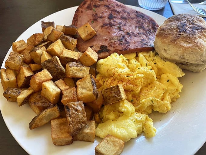 A breakfast plate that hits all the right notes &ndash; crispy potatoes, fluffy eggs, and that perfectly browned ham steak.