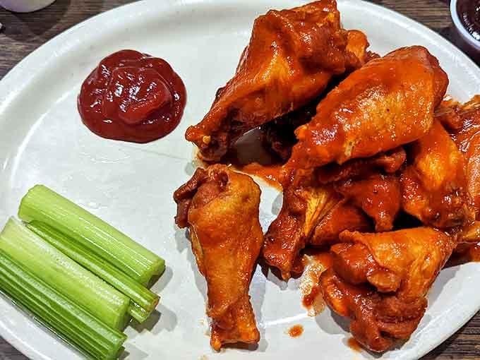 Buffalo wings that don't mess around &ndash; saucy, substantial, and served with the obligatory celery sticks that nobody actually eats.