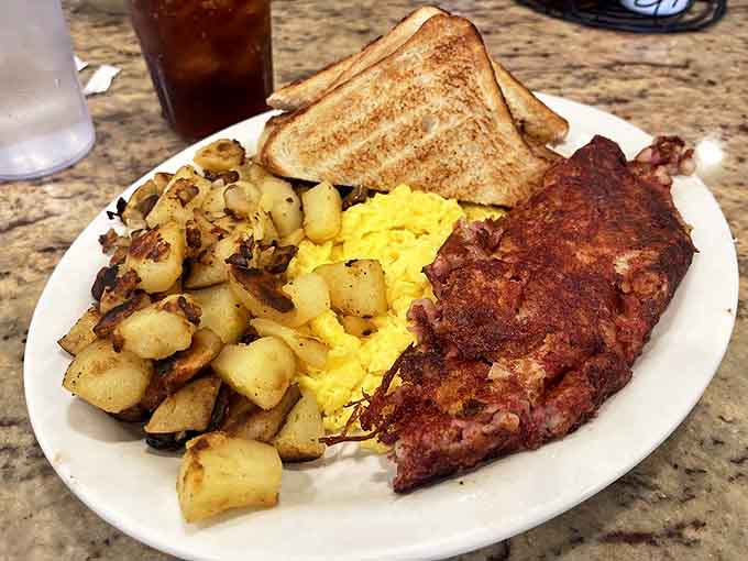 Corned beef hash that would make your Irish grandmother weep with joy. The eggs and toast are just supporting actors in this meaty morning drama.