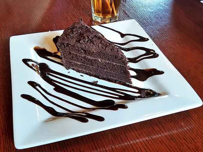 Chocolate cake drizzled with artistic abandon &ndash; proof that dessert can be both rustic and sophisticated, like the restaurant itself.