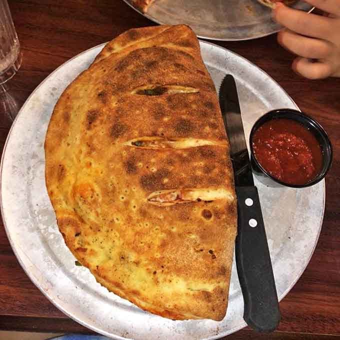 Not all heroes wear capes—some come folded into half-moons of golden dough, stuffed with treasures, and served with a side of marinara.