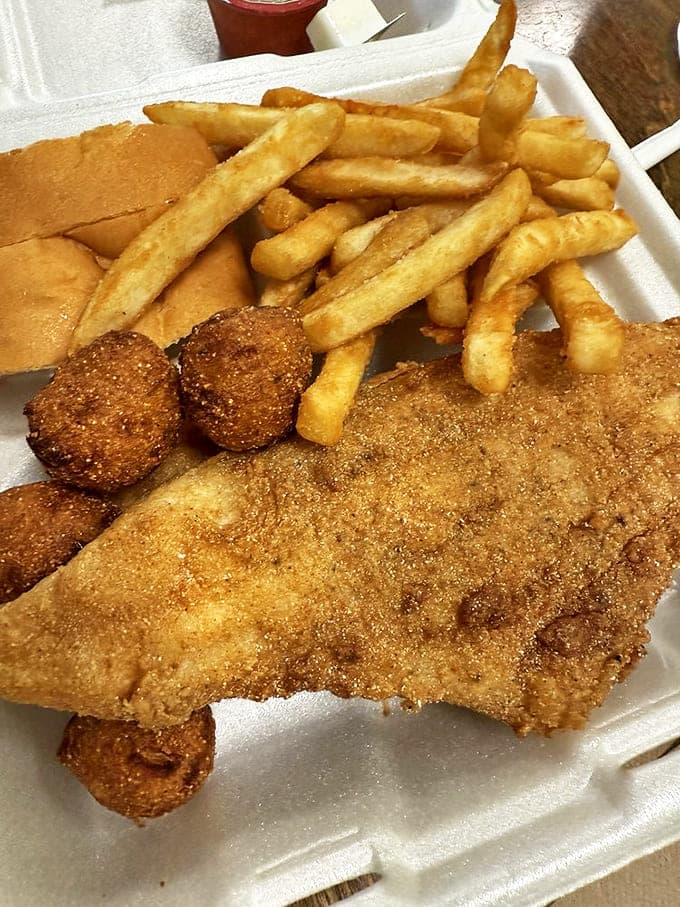 The catfish plate arrives with that perfect golden crust that makes Mississippi seafood lovers weak in the knees.