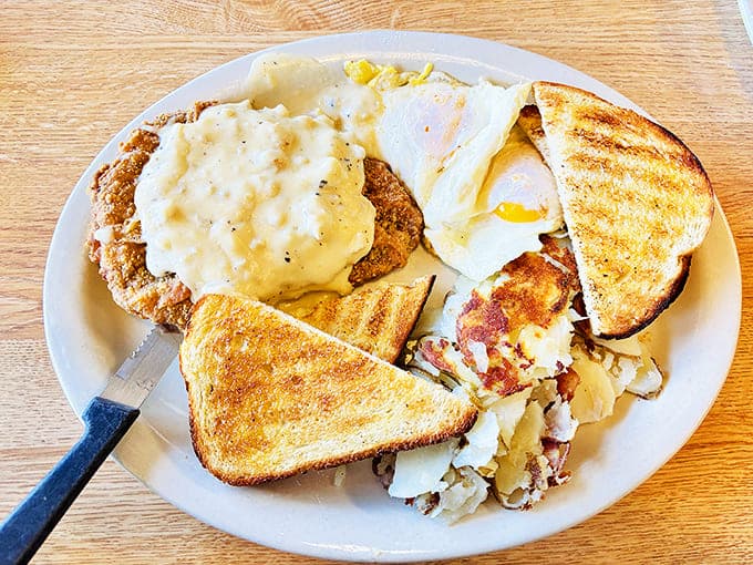 The chicken fried steak breakfast: where crispy, savory coating meets creamy gravy in a dance that's been perfecting itself since pioneer days.