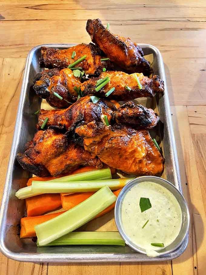These wings aren't just cooked &ndash; they're transformed through fire and spice into crispy, succulent morsels that demand to be devoured.