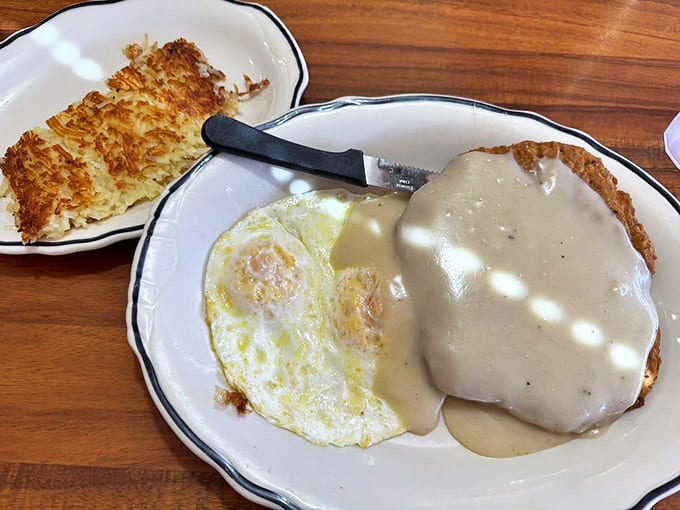 Country-fried steak smothered in gravy alongside a sunny-side-up egg &ndash; the kind of breakfast that makes you want to take a nap by noon.