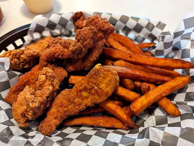 Fried chicken tenders with sweet potato fries&mdash;the ultimate comfort food power couple that makes you wonder why you'd ever order anything else.