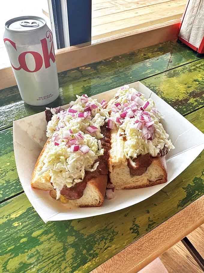 The Chili Slaw Dog brings together two perfect hot dog toppings in one magnificent creation. It's like a flavor reunion you never want to end.