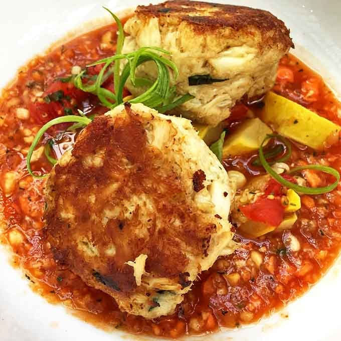 Crab cakes with personality and zero filler anxiety. Virginia Beach's answer to the question "What would the ocean taste like if it were crispy?"