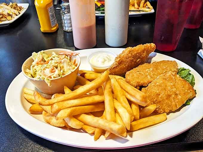 Golden-battered fish flanked by an army of crispy fries and coleslaw&mdash;a plate that would make coastal towns jealous of this landlocked delight.