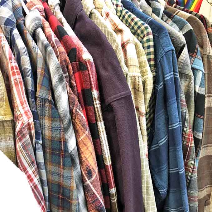 The flannel rainbow: Each shirt has weathered seasons of Vermont winters before finding its way here, waiting for a new adventure.
