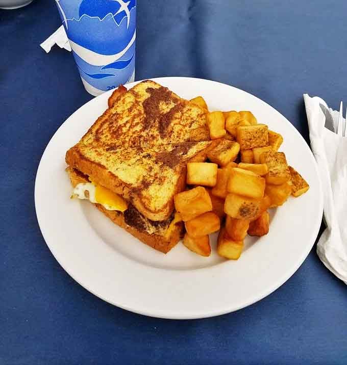 French toast that's achieved the perfect golden-brown status, with home fries that look like they're auditioning for a breakfast hall of fame.