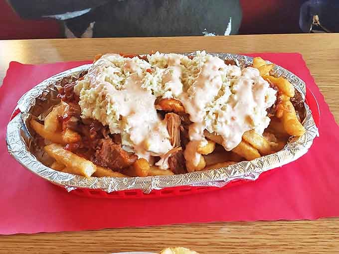 Loaded fries that blur the line between side dish and main event. The kind of comfort food that makes you want to hug the chef.