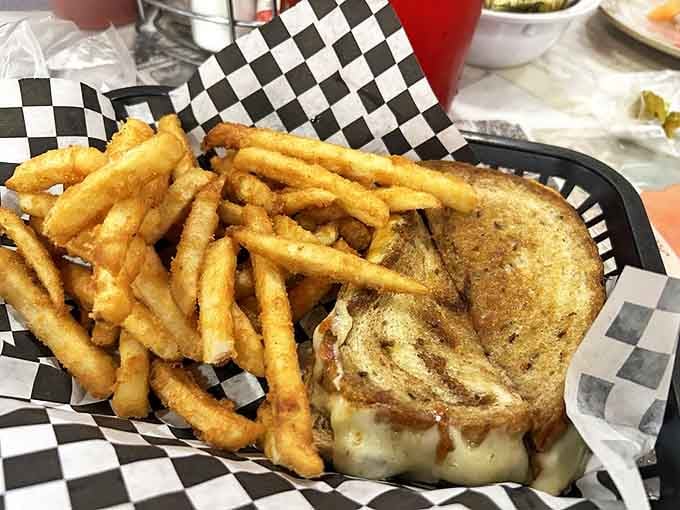 Not just any grilled cheese—this is the sandwich equivalent of a warm hug. Golden-brown perfection with fries so crisp they practically snap when you look at them.