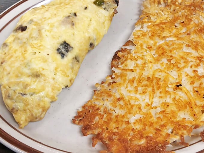 The crispy-edged, golden hash browns and perfectly folded omelet &ndash; proof that sometimes the simplest dishes require the most skill.