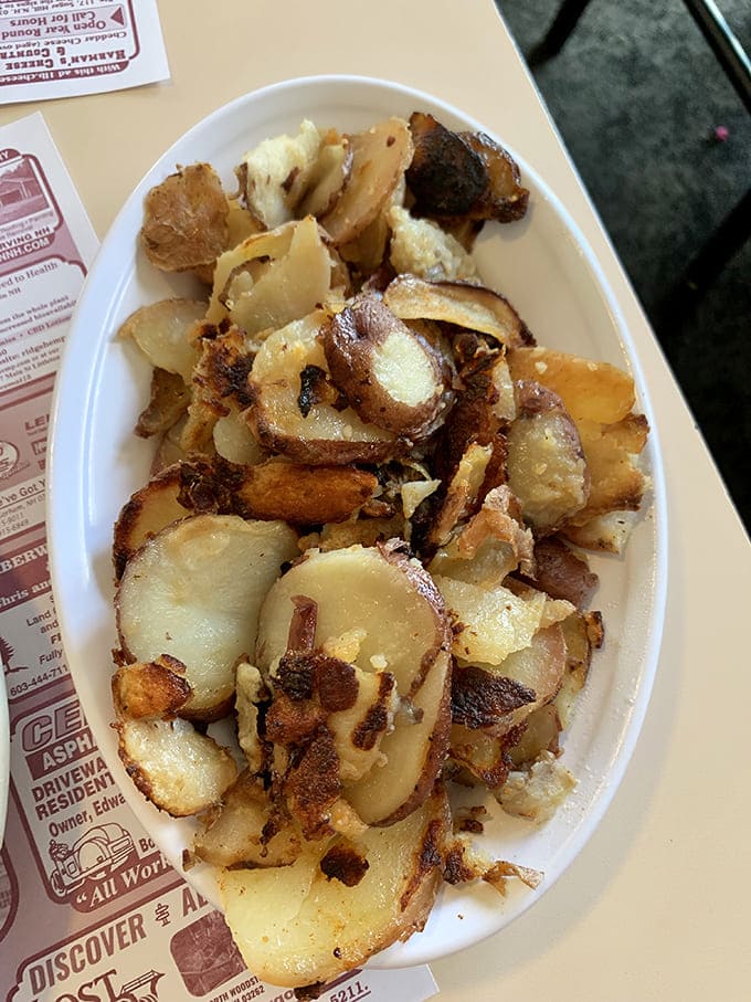 These home fries aren't just potatoes &ndash; they're little golden-brown islands of crispiness that deserve their own zip code in Flavor Country.