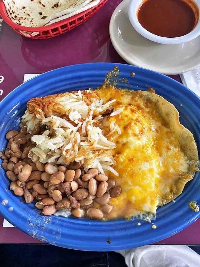 Huevos rancheros done right&mdash;a beautiful mess of eggs, beans, and melted cheese that makes you wonder why anyone bothers with cereal.
