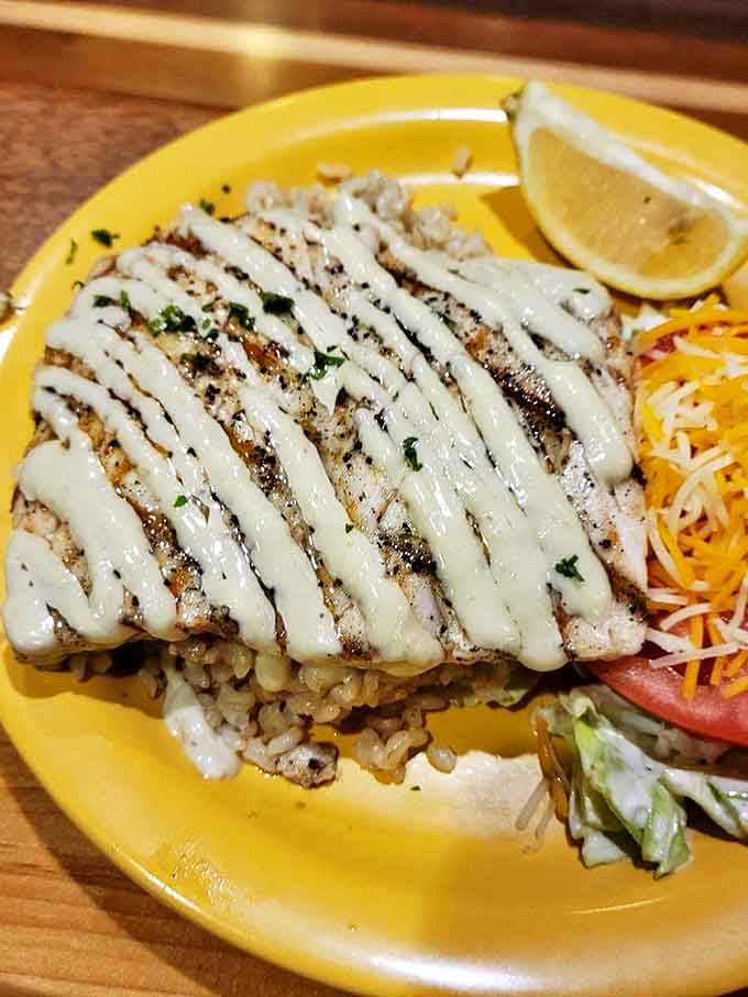This grilled mahi-mahi with its artistic sauce drizzle belongs in the Louvre of lunch. Simple perfection on a sunshine-yellow plate.