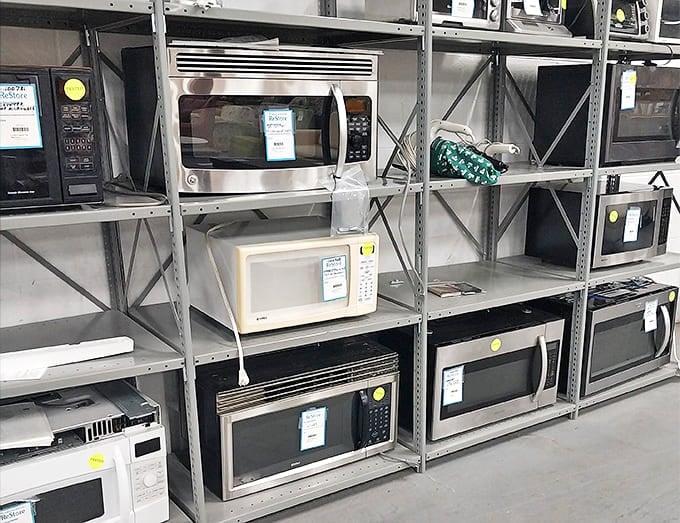 Microwaves lined up like soldiers ready to reheat your leftovers without requiring you to take out a small loan first.