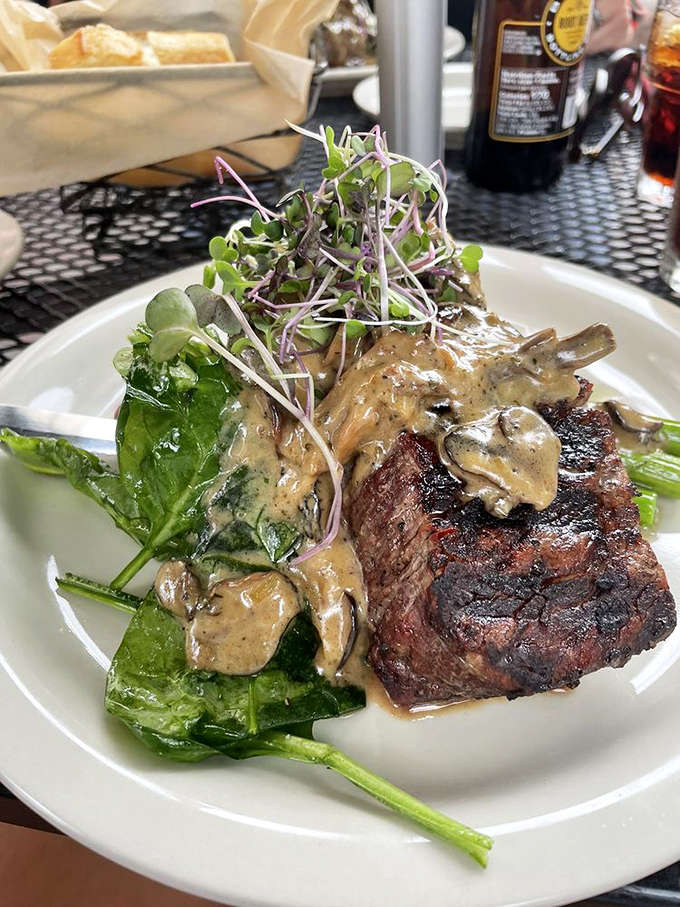 This steak doesn't just sit on the plate&mdash;it lounges confidently, draped in mushroom sauce like it's posing for a culinary calendar.