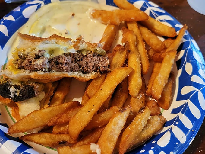 Half-eaten burgers tell the best stories. This patty melt with crispy fries didn't stand a chance against a hungry traveler fresh from the Badlands.