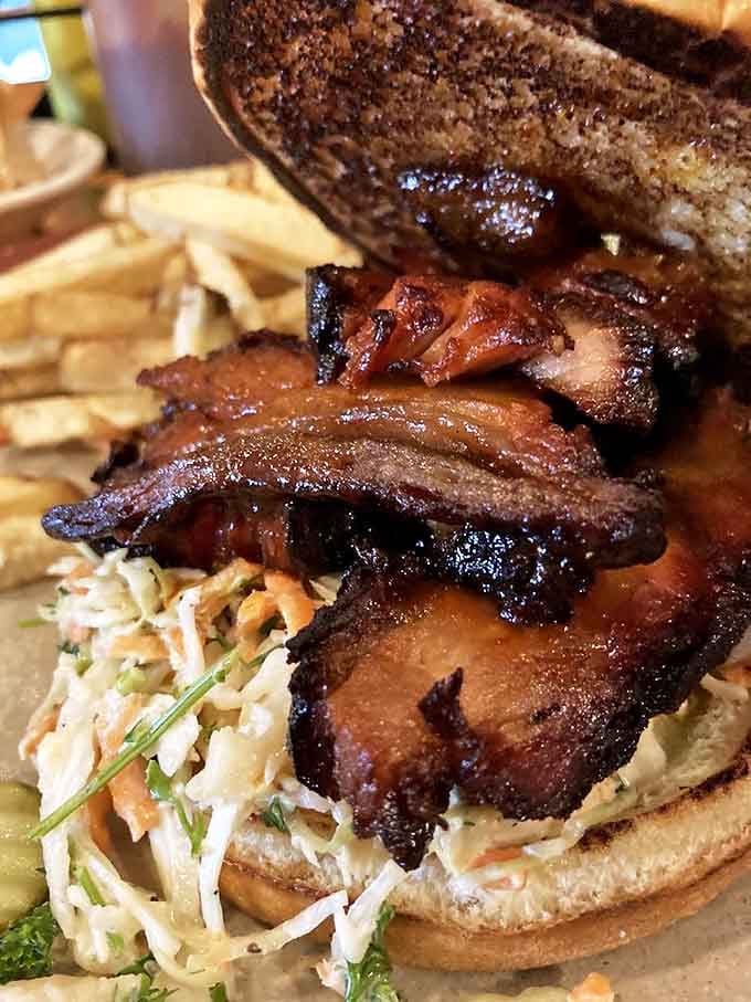 This pork belly sandwich is architecture in food form &ndash; layers of smoky, fatty goodness balanced with crisp slaw that might just make you weep with joy.