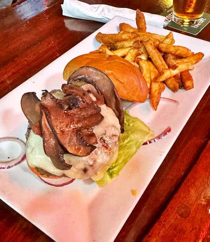 This isn't just a burger; it's architecture you can eat &ndash; layers of flavor stacked with precision and served with golden fries.