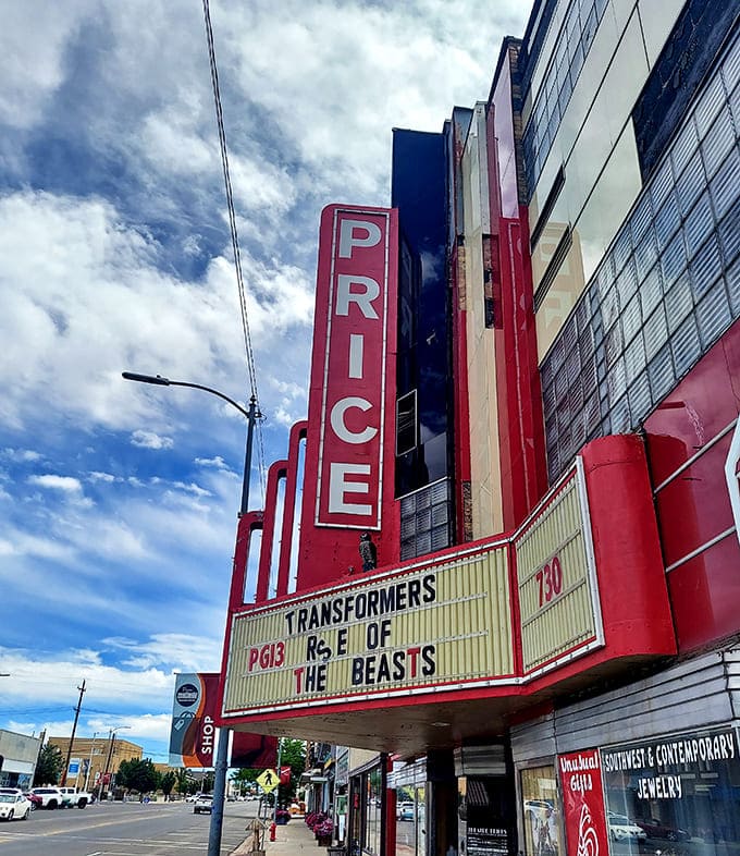 The Price Theatre marquee lights up downtown with current films at yesterday's prices – nostalgia without the inflation.