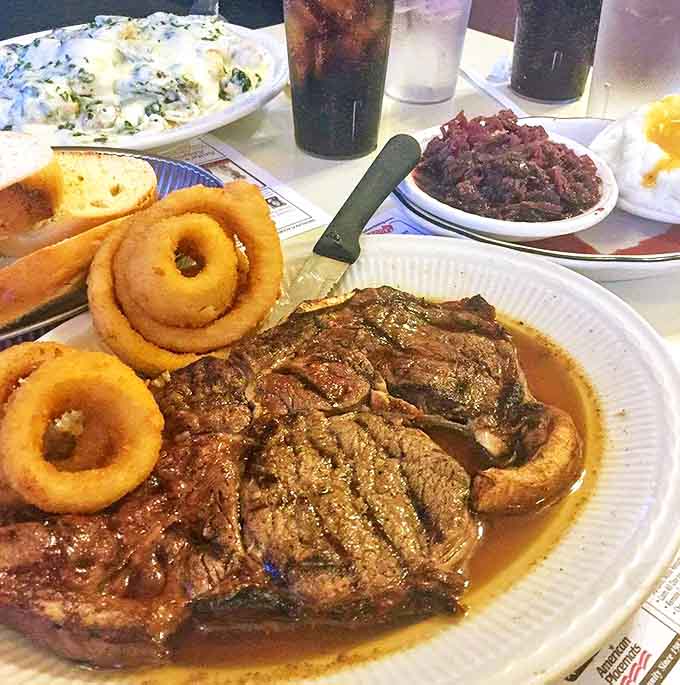 Prime rib swimming in au jus with onion rings the size of bracelets. Not so much a meal as a carnivorous celebration that would make Fred Flintstone weep with joy.