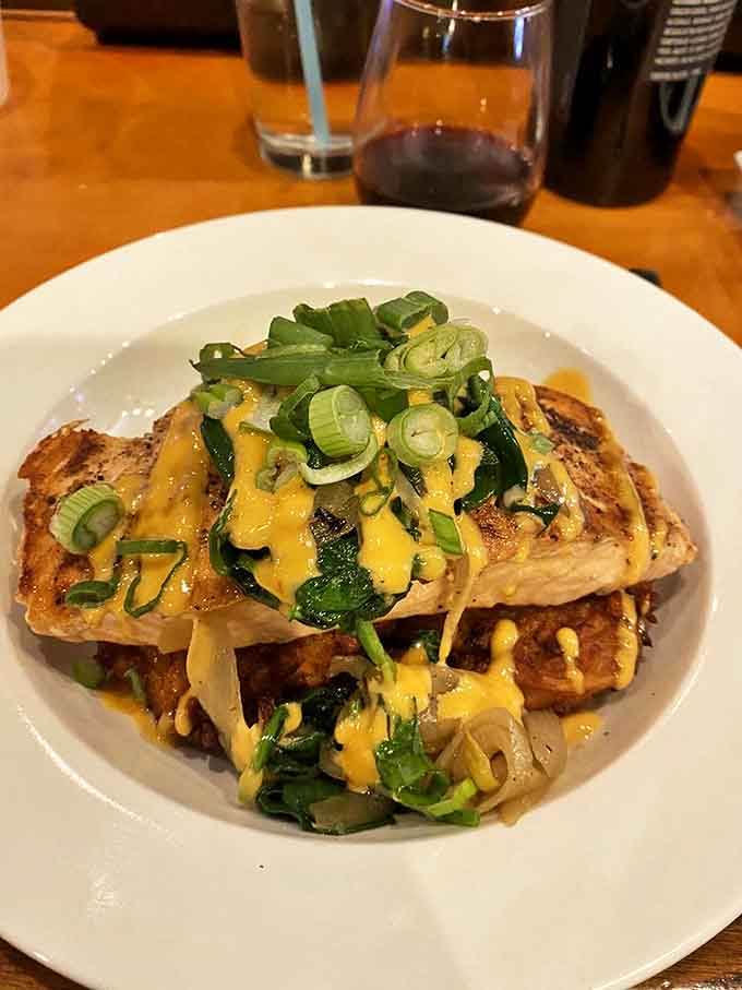 This salmon isn't just a fish&mdash;it's a flavor festival topped with melted cheese and scallions. The ocean called; it wants its star performer back.