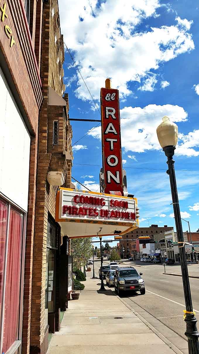 The iconic El Raton Theatre marquee stands as a beacon of entertainment on the main street, promising movie magic at small-town prices.