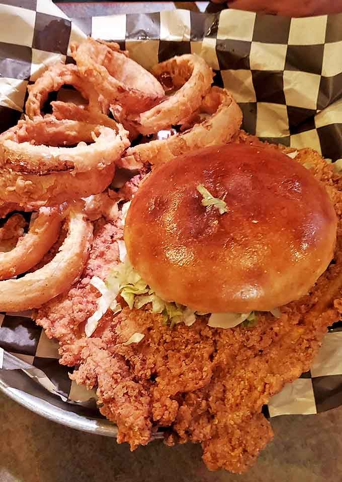 The pork tenderloin sandwich here doesn't just hang over the plate's edge&mdash;it practically needs its own zip code. Midwestern comfort food at its finest.